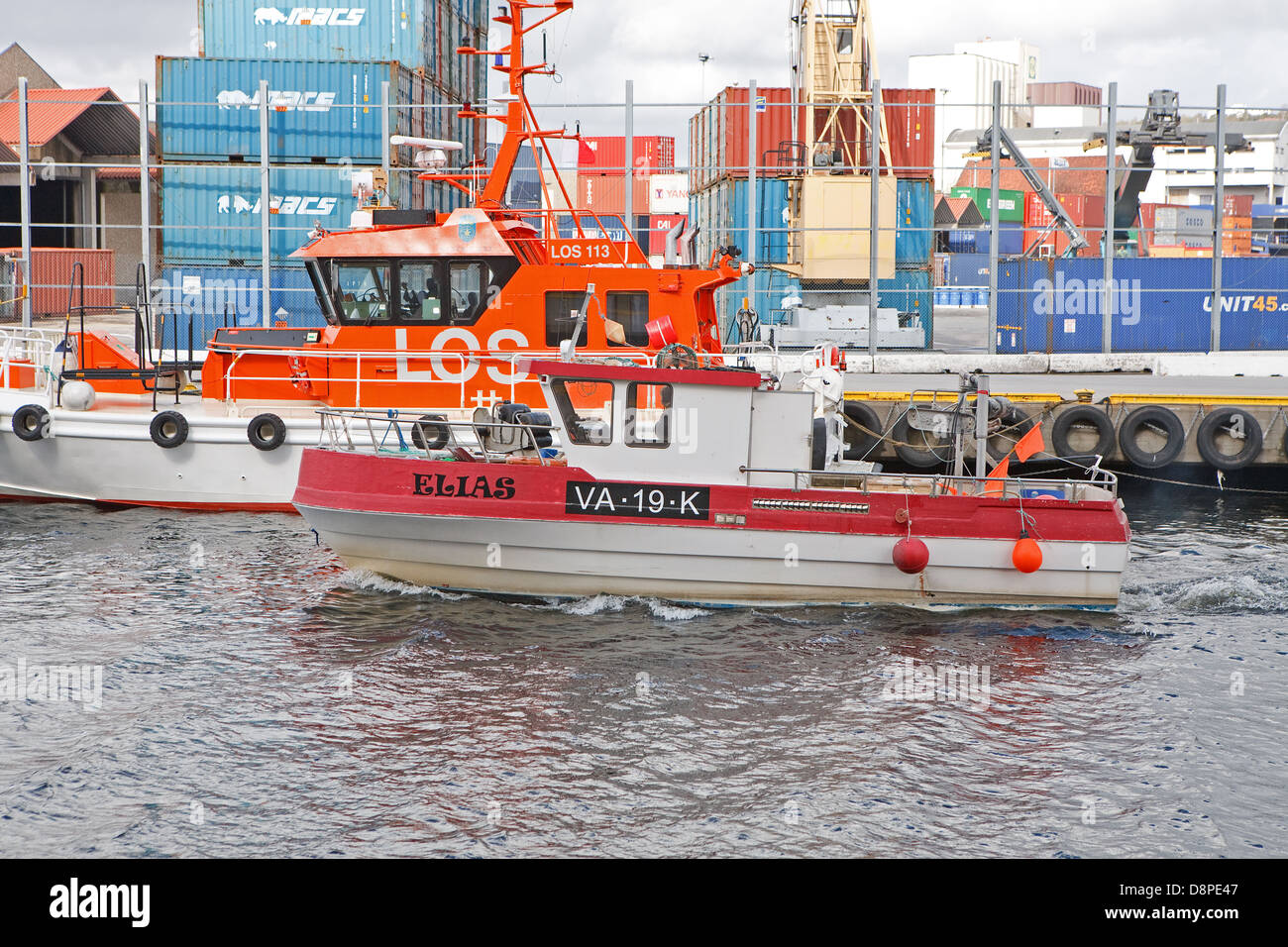 Small white boat passes hi-res stock photography and images - Alamy