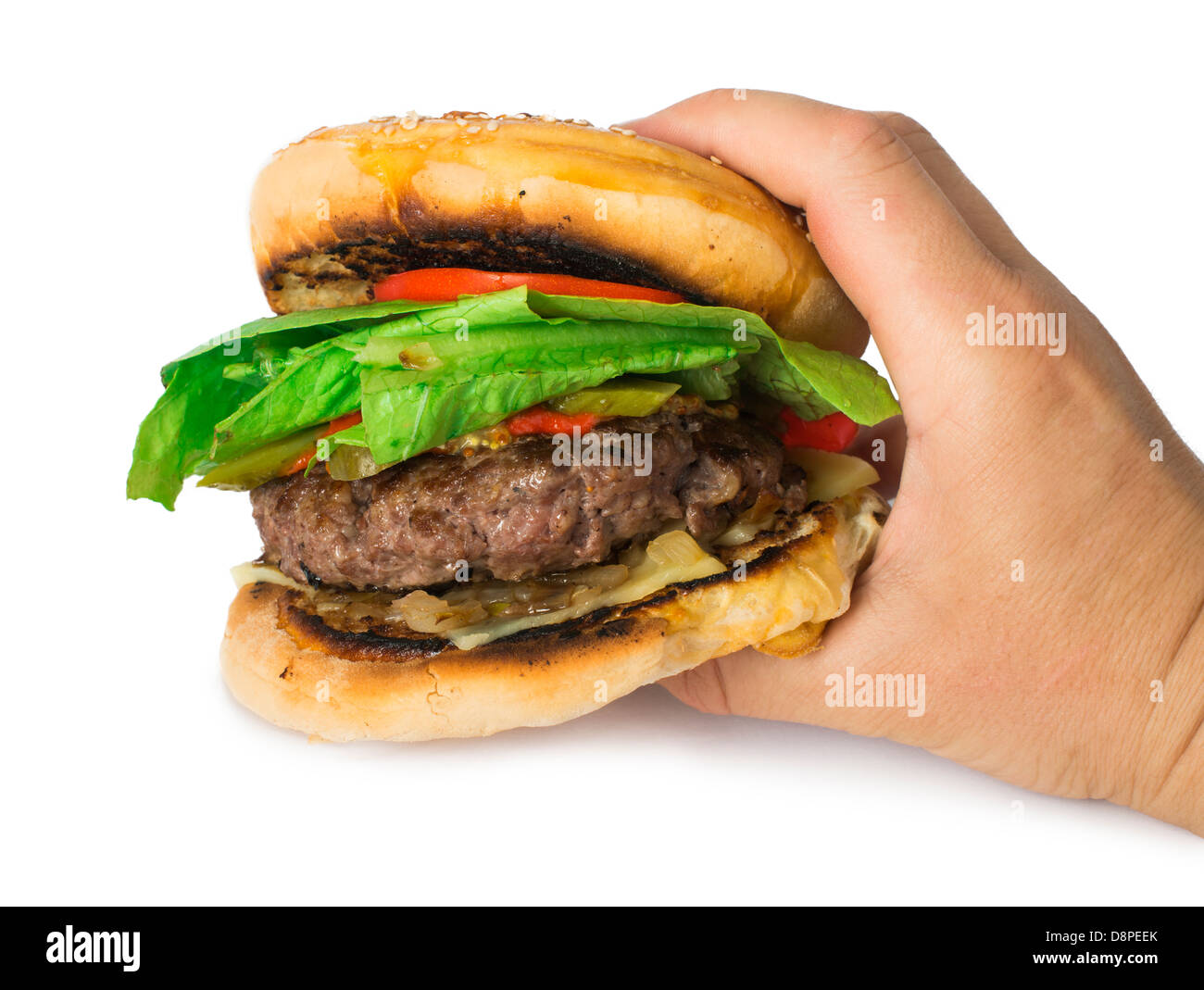 Hand holding Hamburger with meat and lettuce. White isolared studio ...