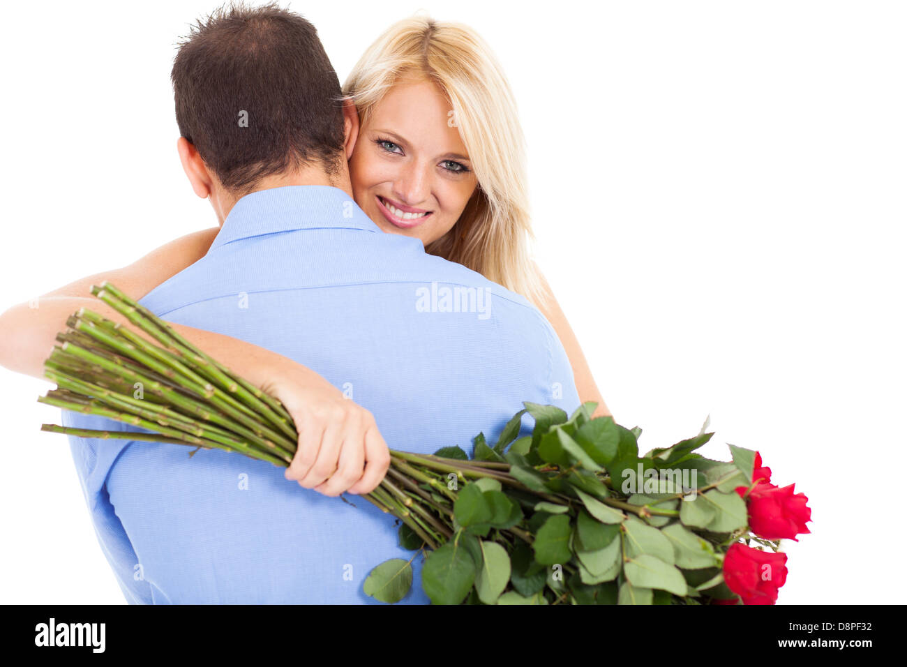 young woman hugging boyfriend with bunch of roses Stock Photo - Alamy
