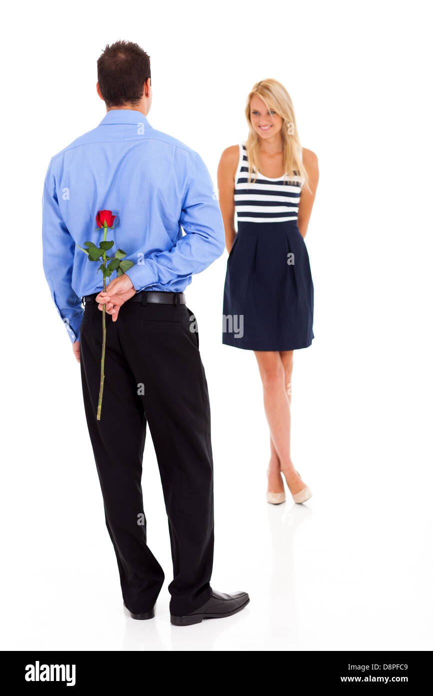 Woman hiding present behind back hi-res stock photography and images ...