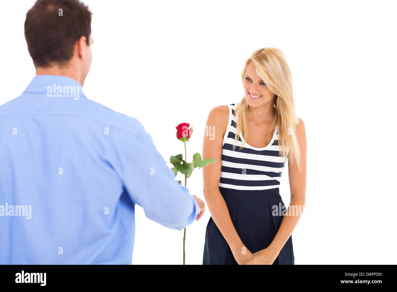 young man giving rose to a beautiful young woman Stock Photo - Alamy