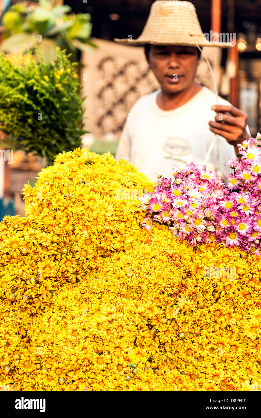 Burmese street sellers at local flower market Mandalay Burma Myanmar ...