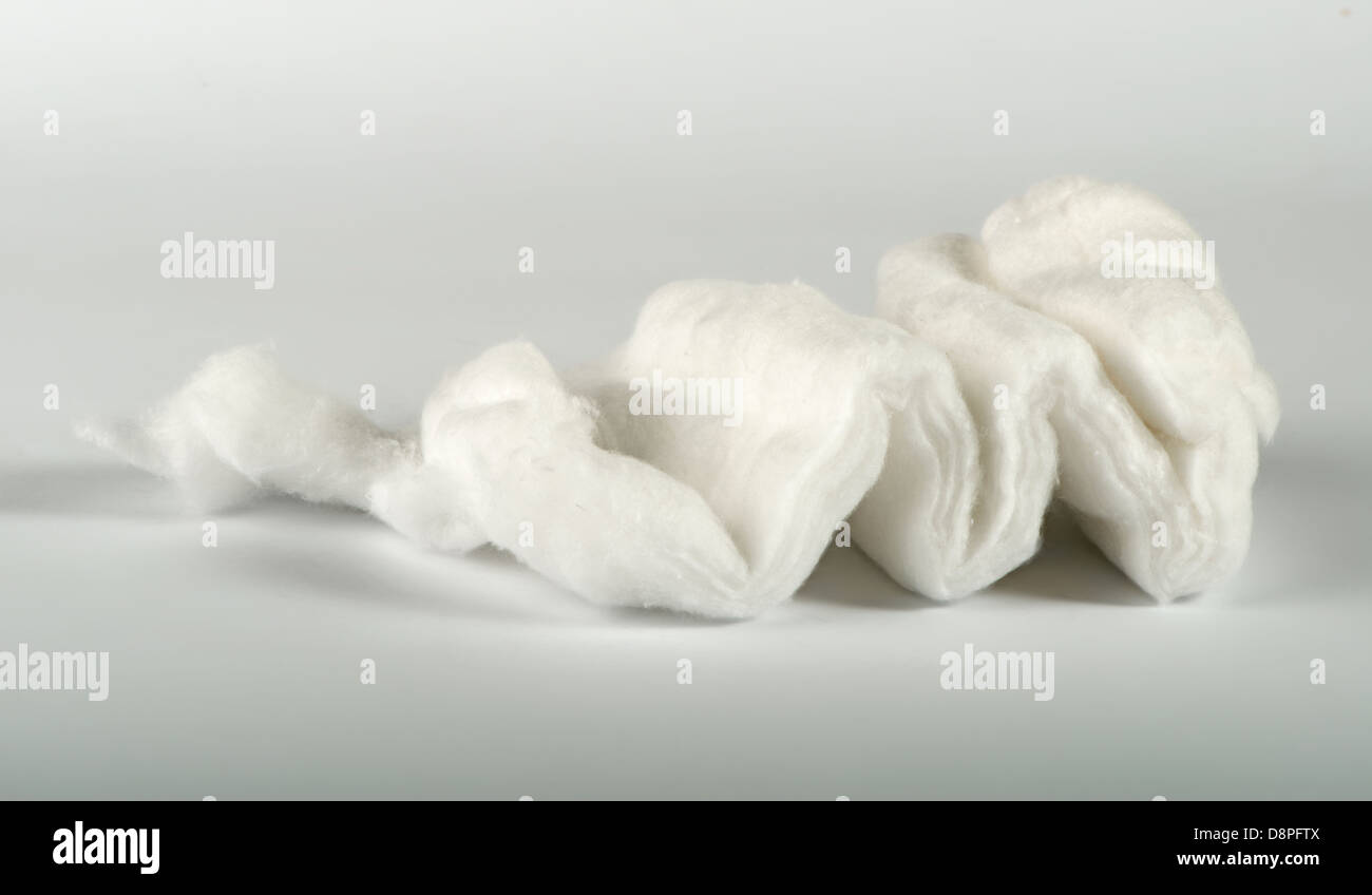 Cotton wool on white background Stock Photo - Alamy