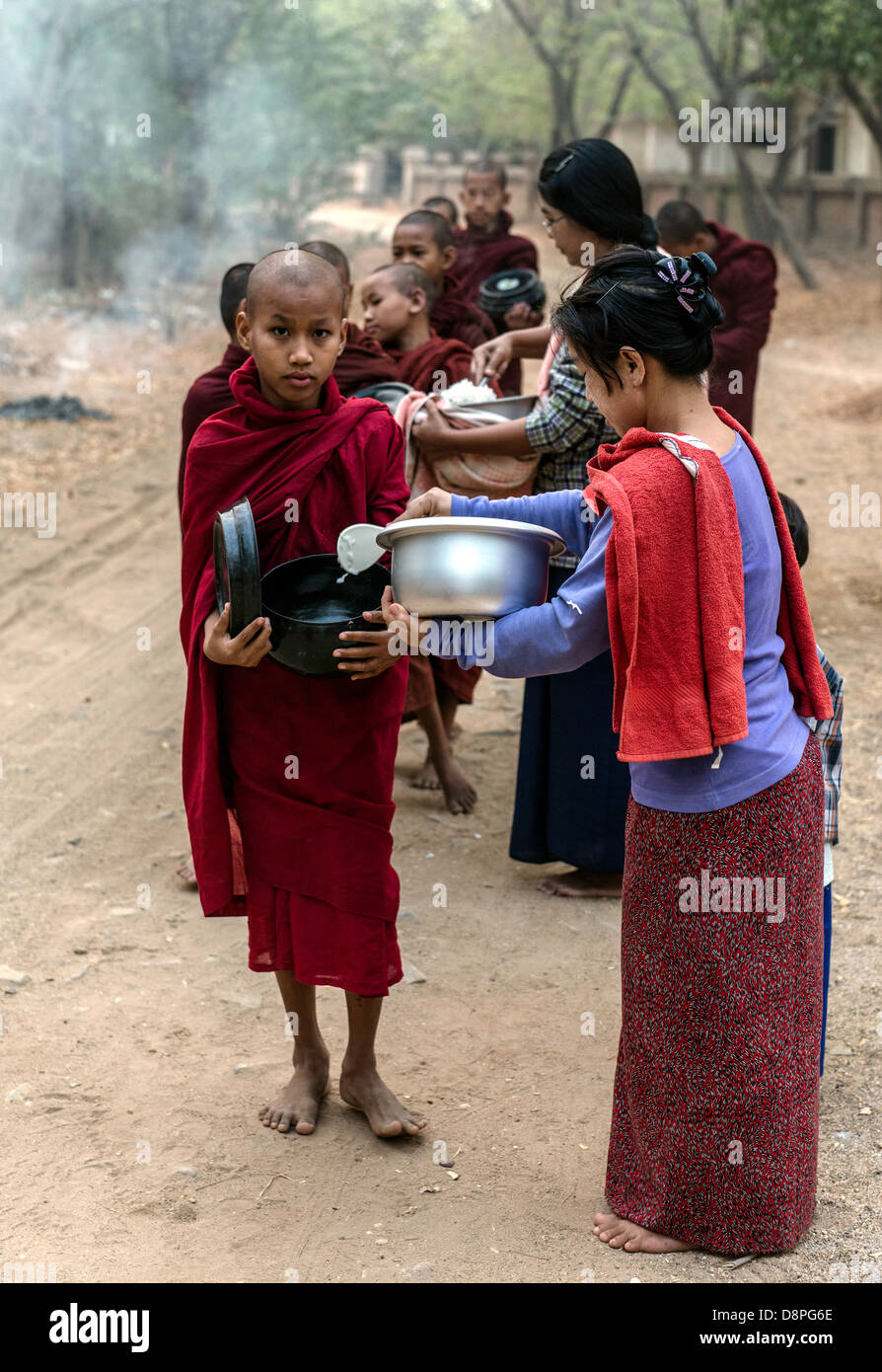 Buddhist monks collecting alms bowls of food in the morning from ...