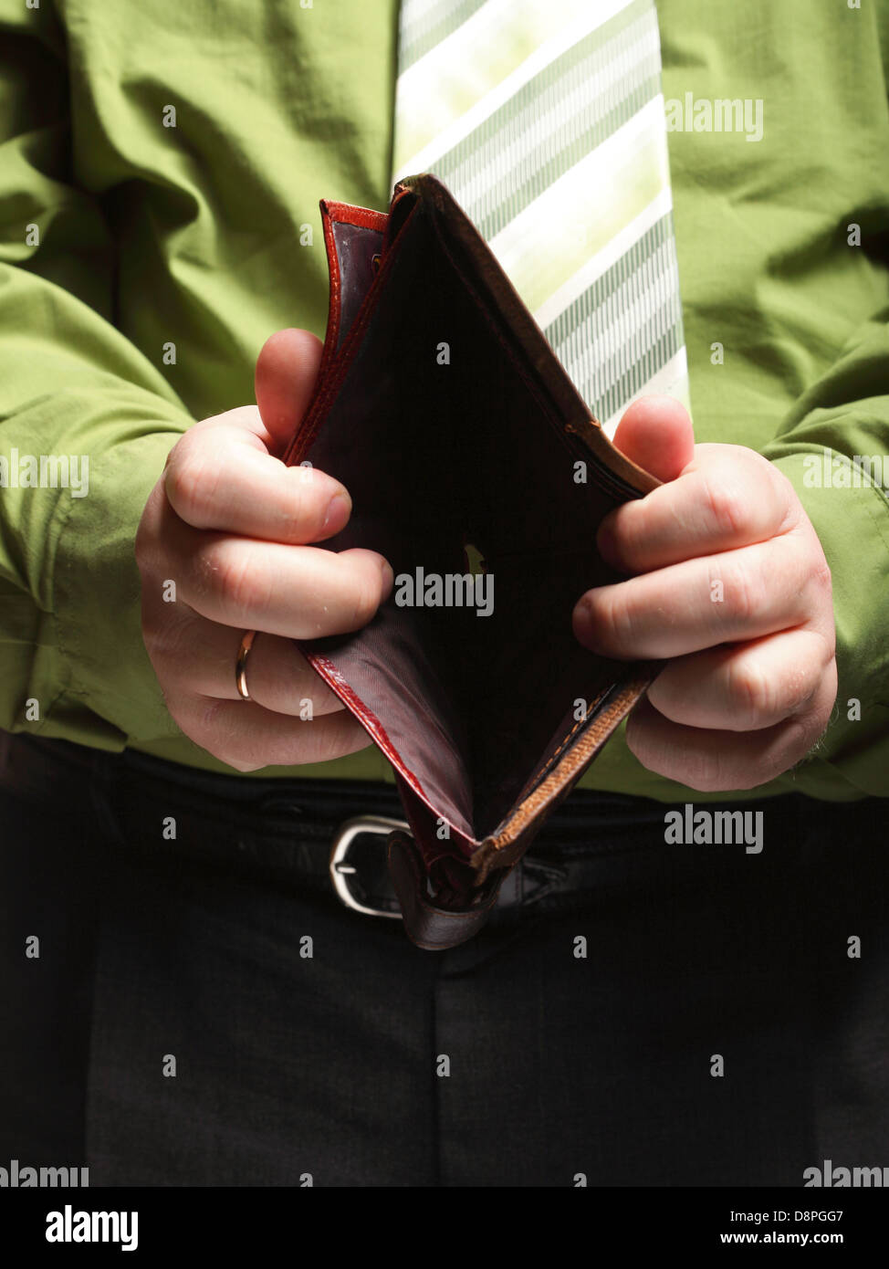 Poor economy represented by empty wallet in businessman's hands Stock ...