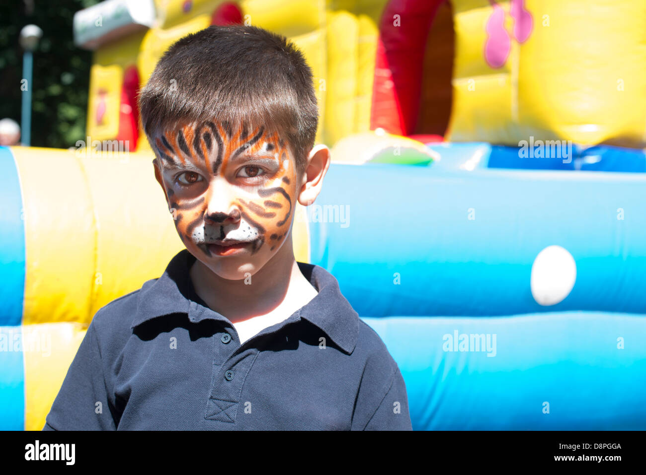 Child with painted face. Tiger paint. Boy on children's holiday Stock ...