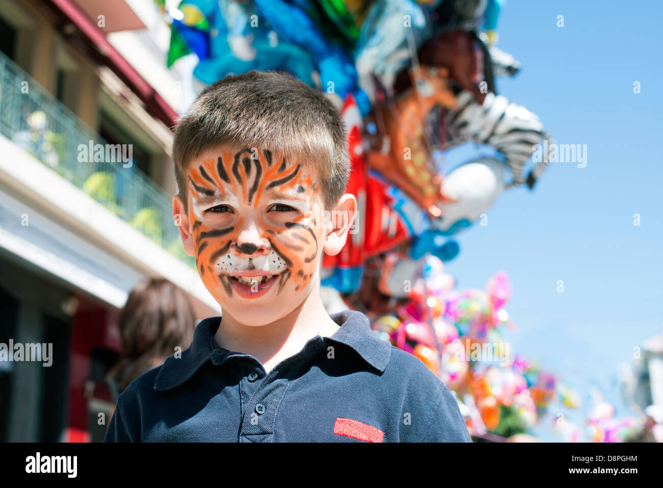 Child with painted face. Tiger paint. Boy on children's holiday Stock ...
