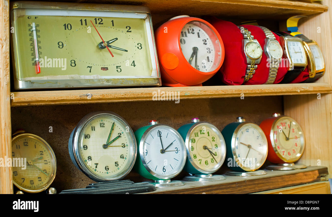 Old clocks on a shelf in shop Stock Photo - Alamy