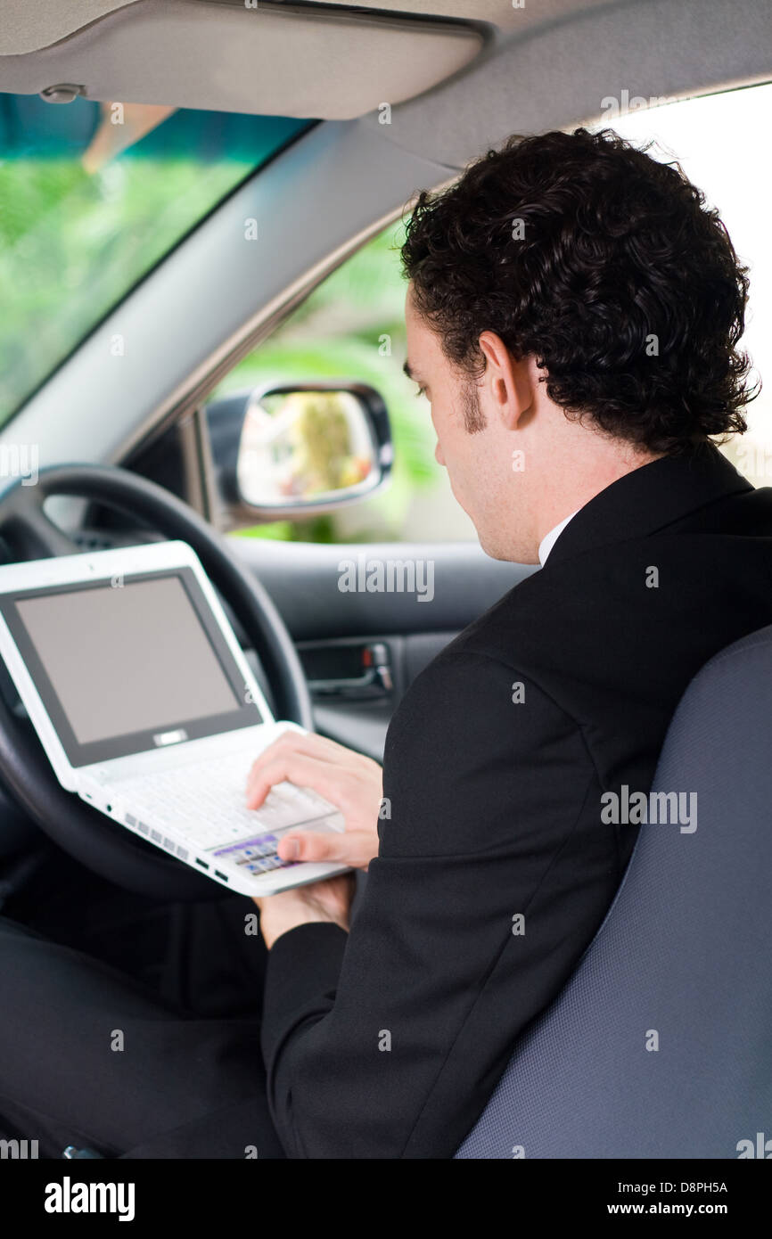 young business man working inside a car Stock Photo - Alamy