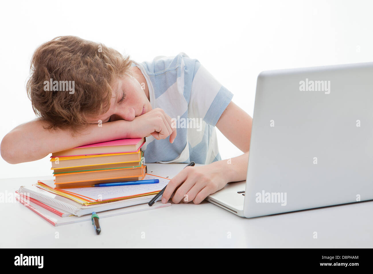 tired student sleeping with homework Stock Photo - Alamy