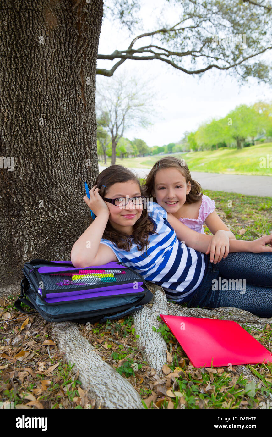 Sister Firends Girls Relaxed Under Tree Park After School With Bag And 3091