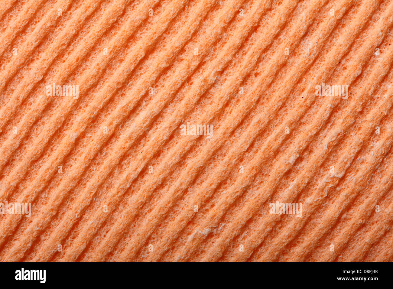 Orange kitchen sponge rubber foam as background texture Stock Photo - Alamy