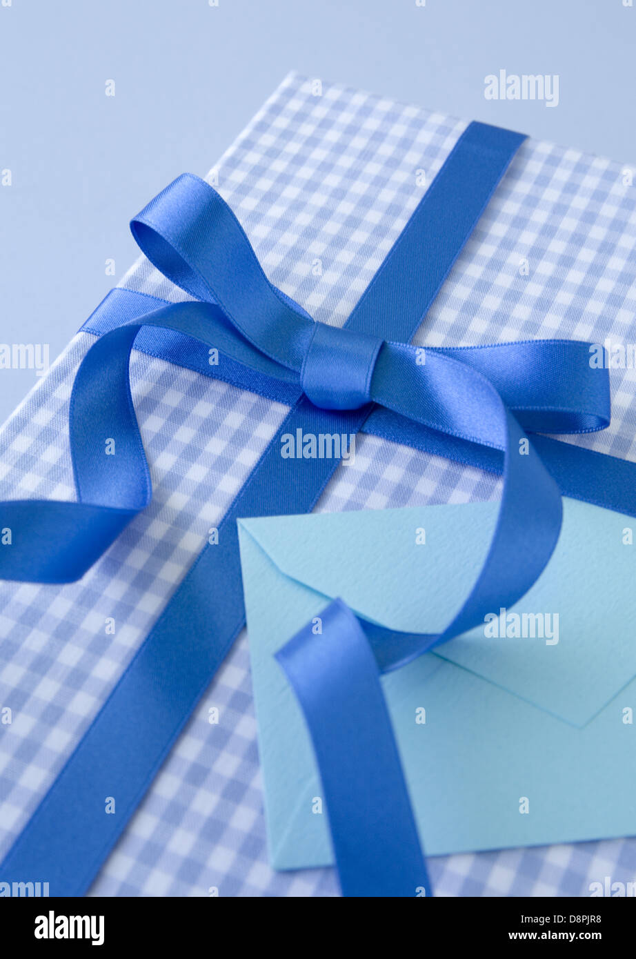 Blue gift box and a greeting card Stock Photo - Alamy