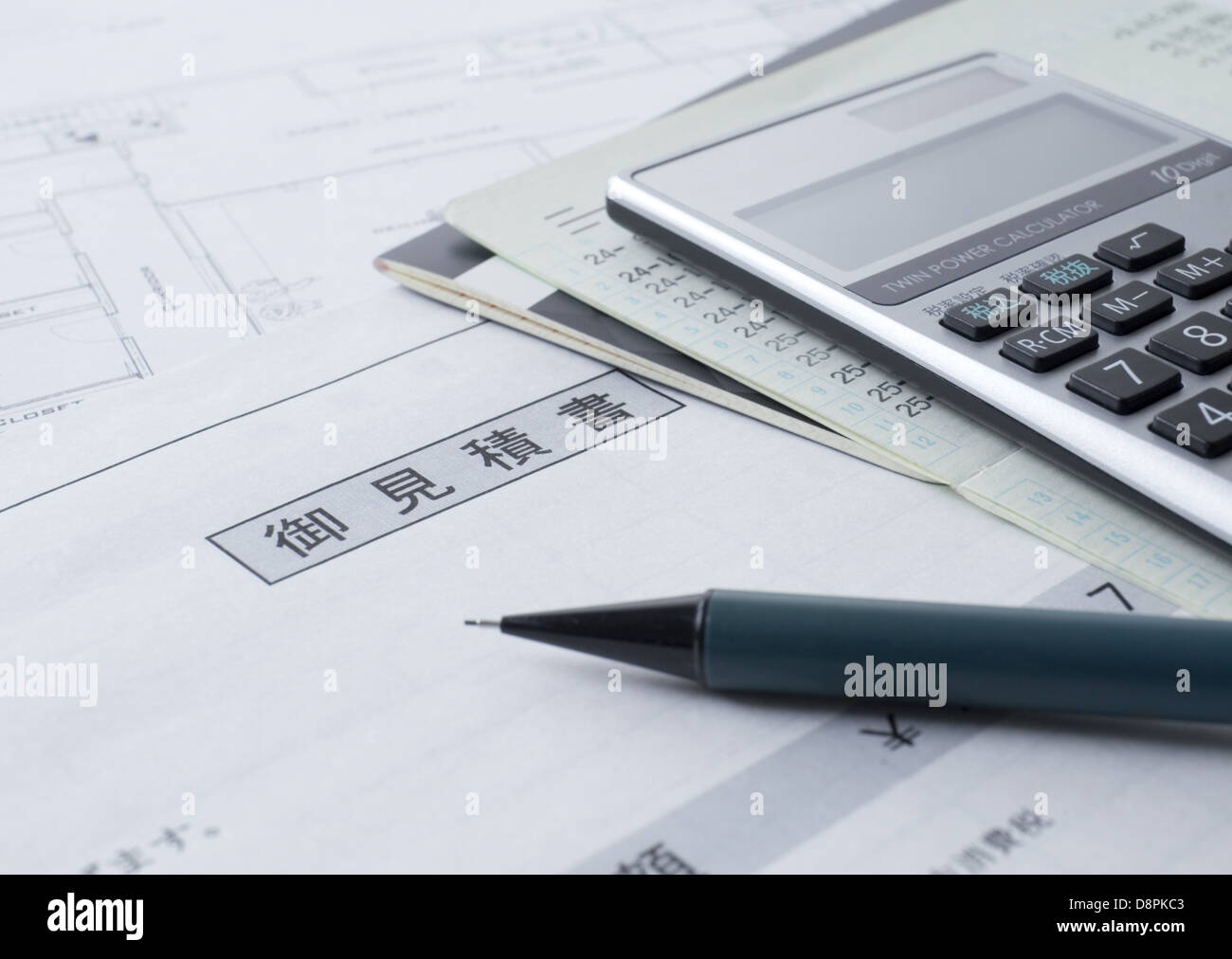 Estimate and a calculator Stock Photo - Alamy