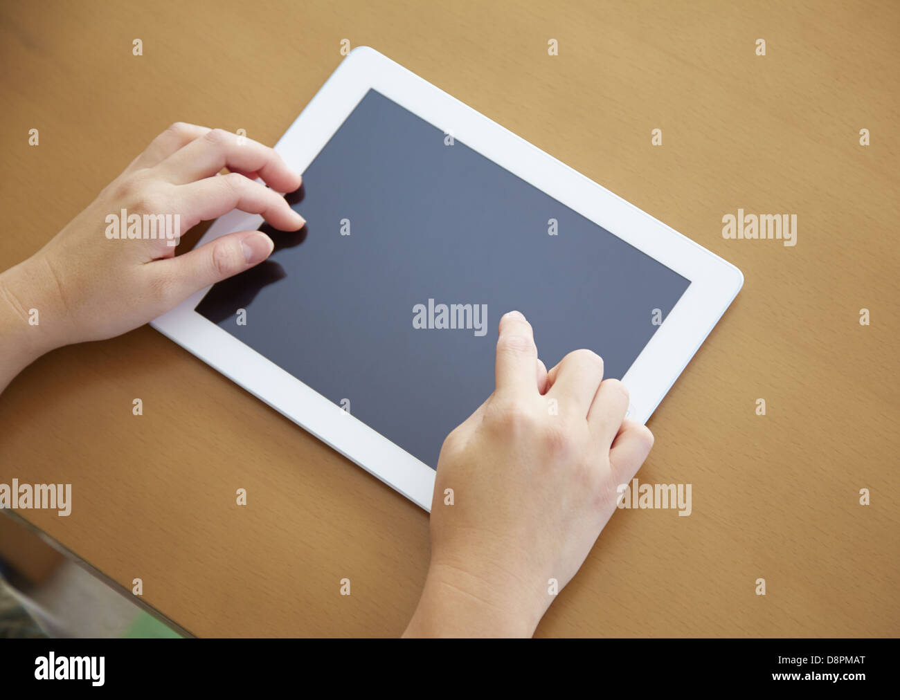 30's woman's hands touching a tablet PC Stock Photo - Alamy