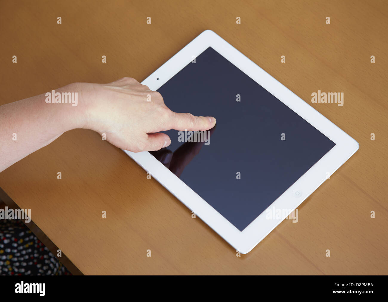 60's woman's hand touching a tablet PC Stock Photo - Alamy