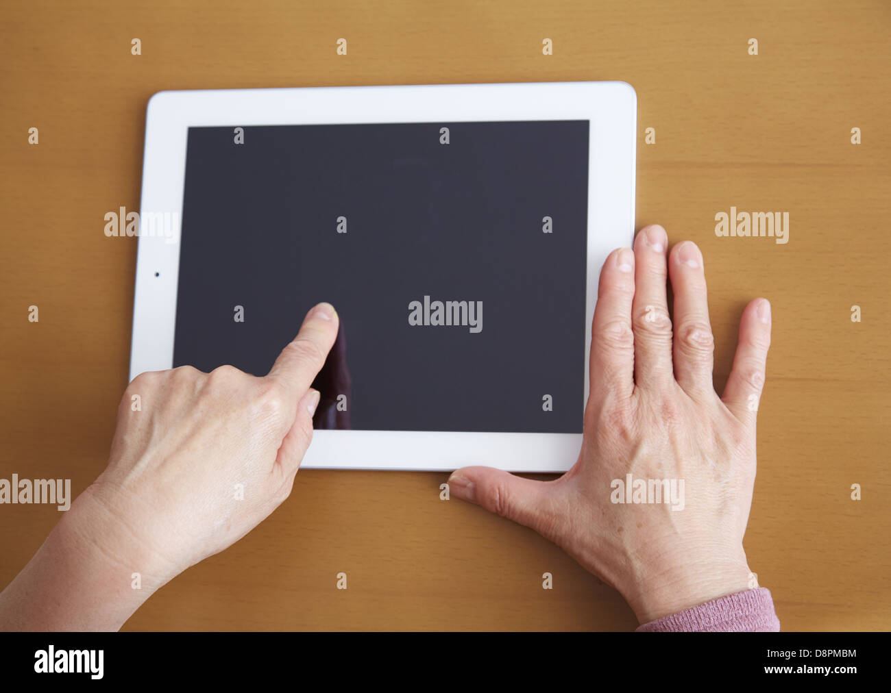 60's woman's hands touching a tablet PC Stock Photo - Alamy