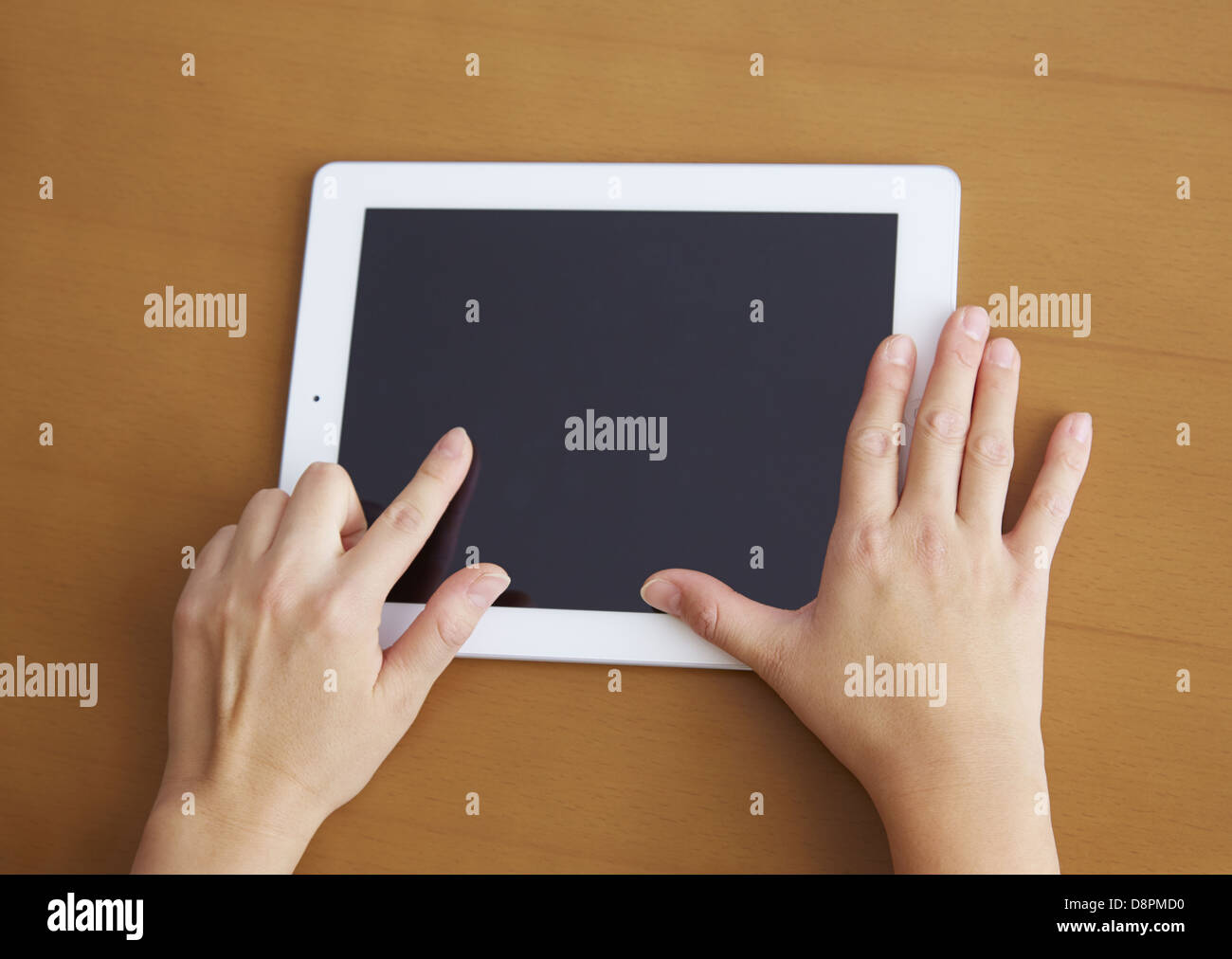30's woman's hands touching a tablet PC Stock Photo - Alamy