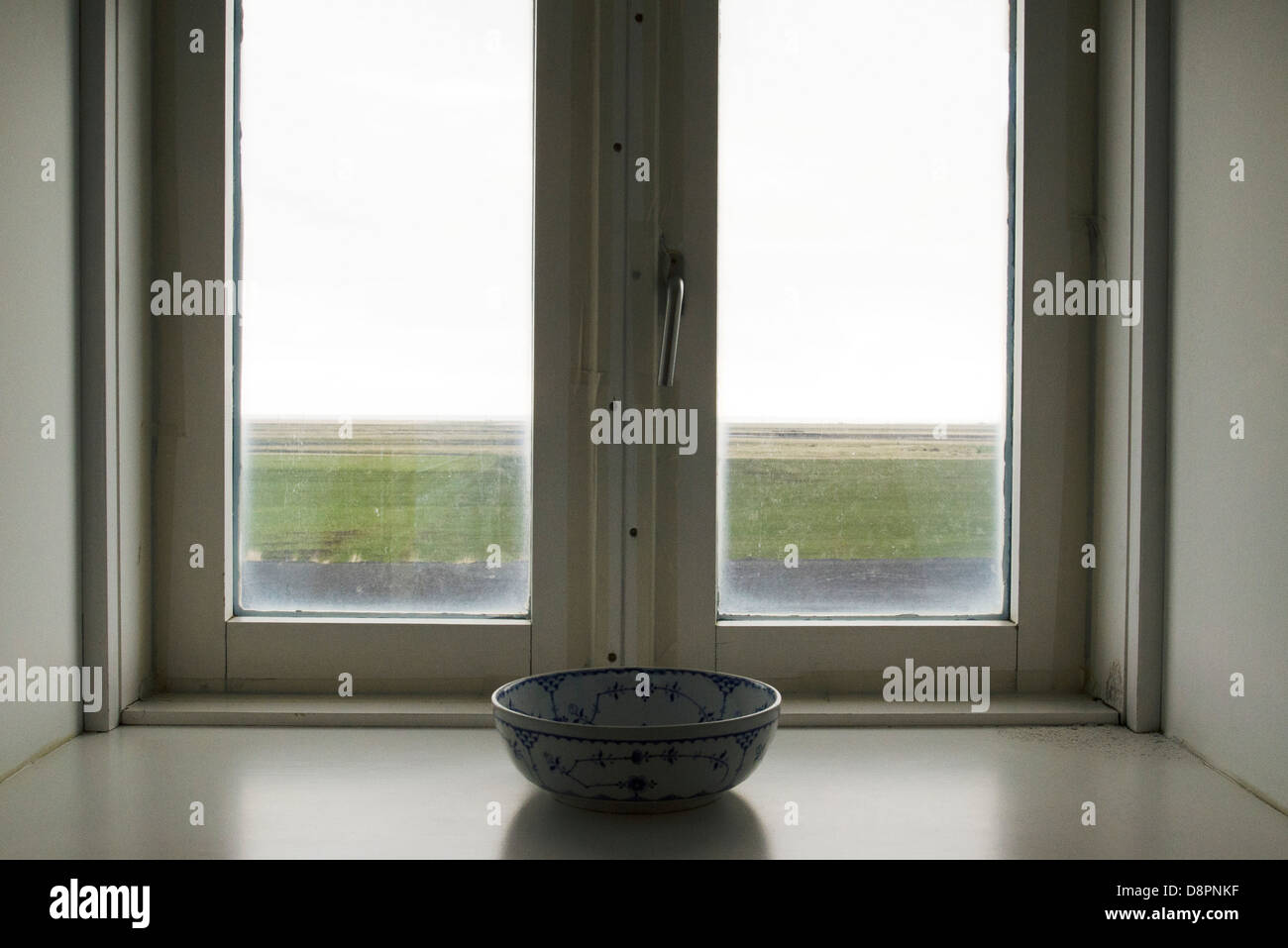 Ceramic bowl in front of window Stock Photo - Alamy