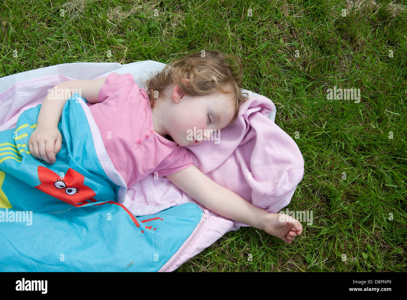 Little girl napping outdoors Stock Photo - Alamy