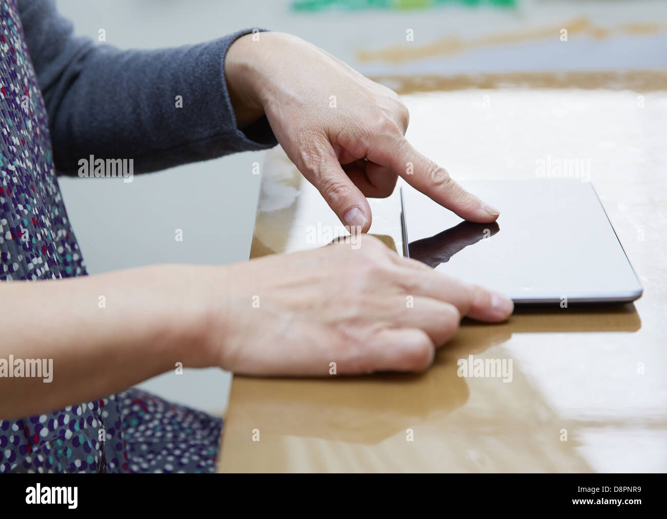 60's woman's hands touching a tablet PC Stock Photo - Alamy