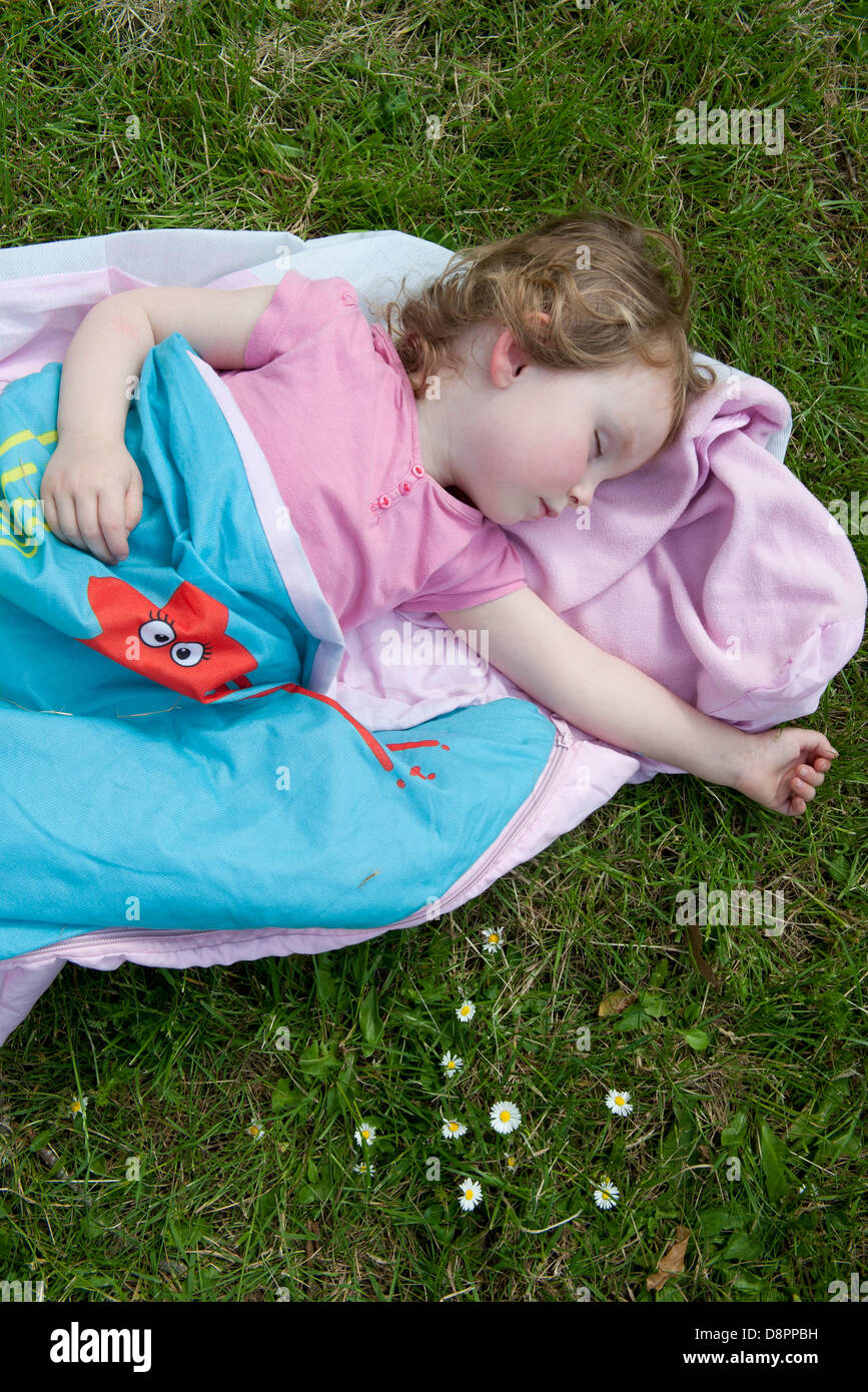 Little girl napping outdoors Stock Photo - Alamy