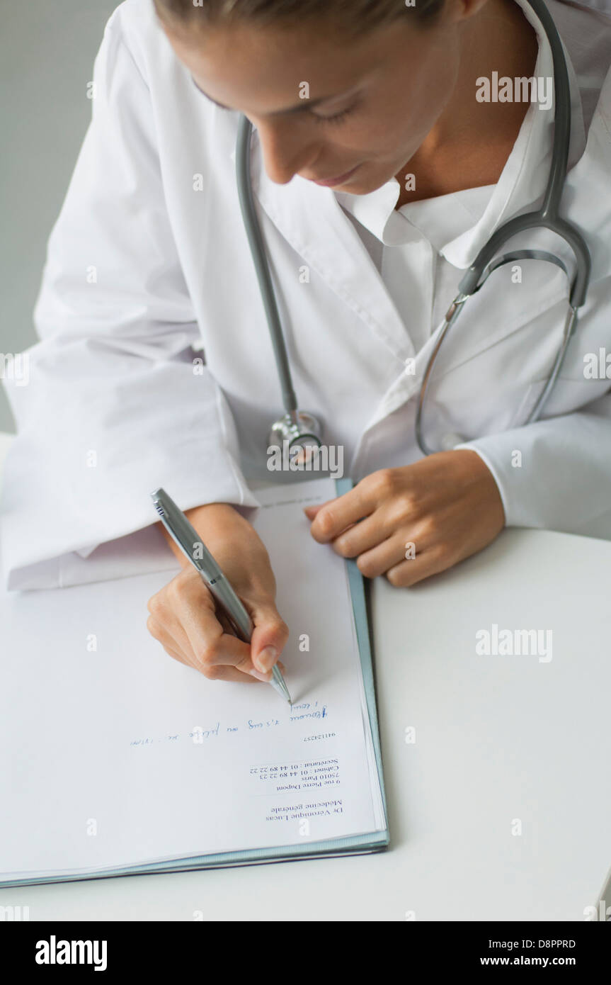 Doctor writing prescription Stock Photo - Alamy