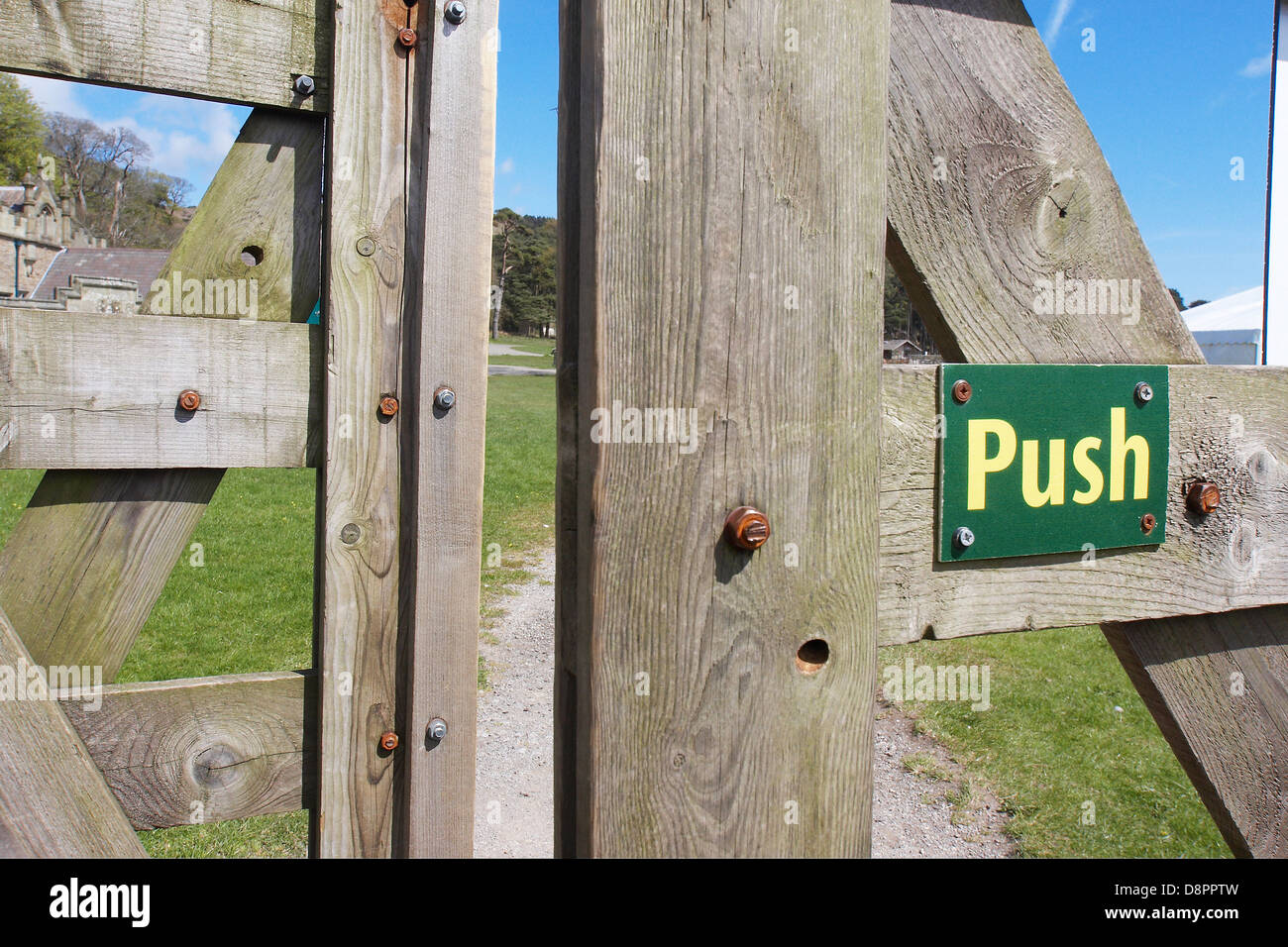 Wooden gate with a push sign on it taken at Margam country park, Wales ...