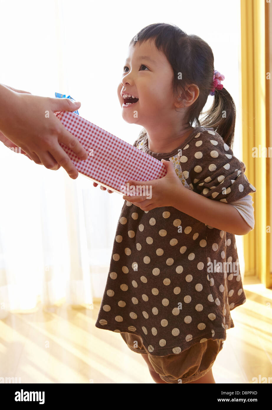 Girl getting a gift Stock Photo - Alamy