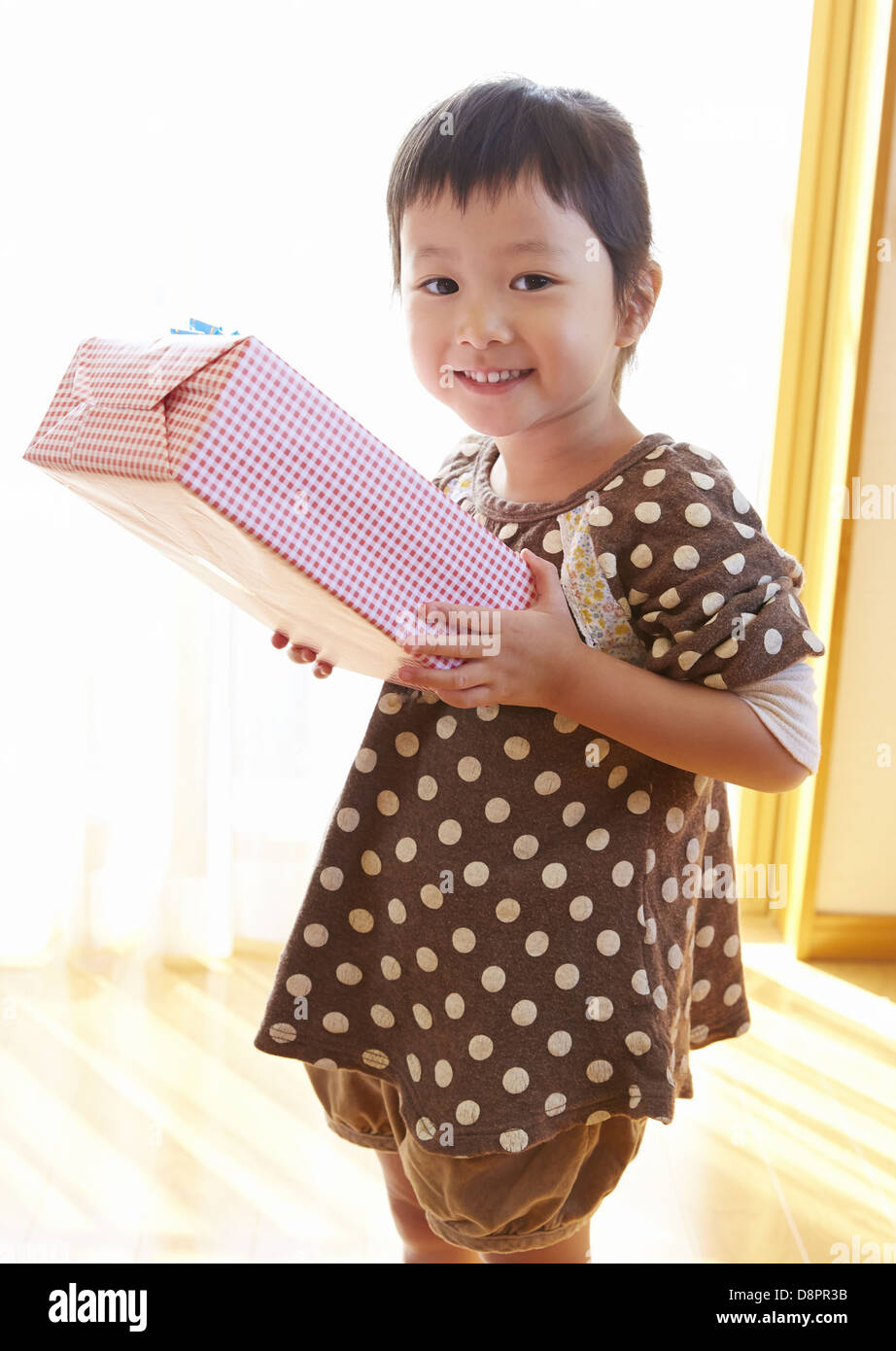 Girl getting a gift Stock Photo - Alamy