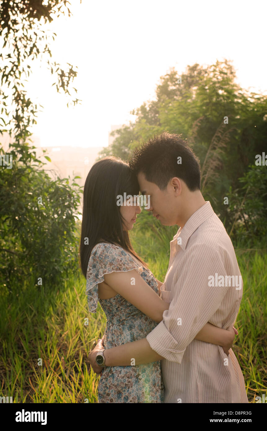 asian chinese romantic couple in the park during sunrise Stock Photo ...