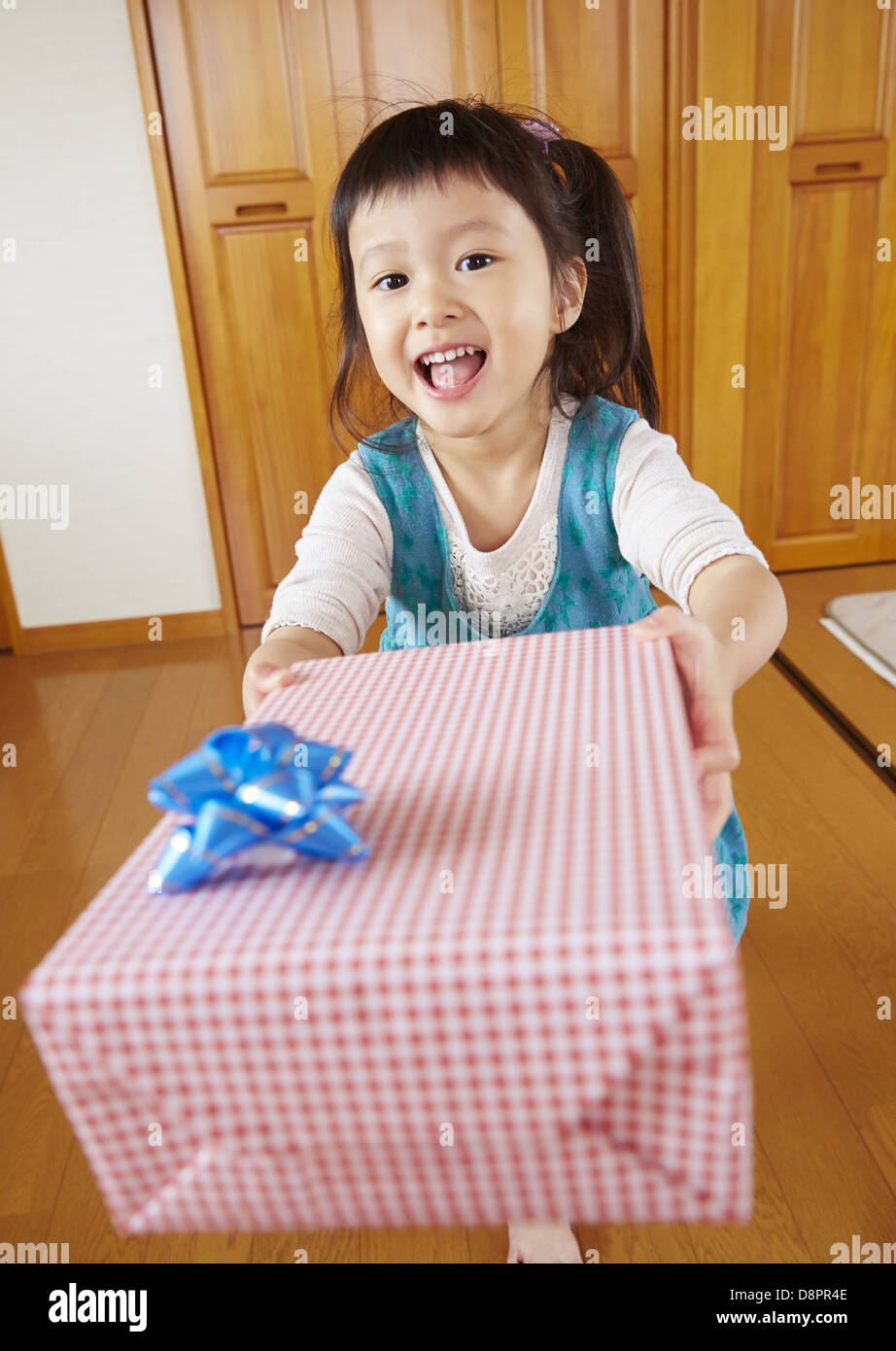 Girl getting a gift Stock Photo - Alamy