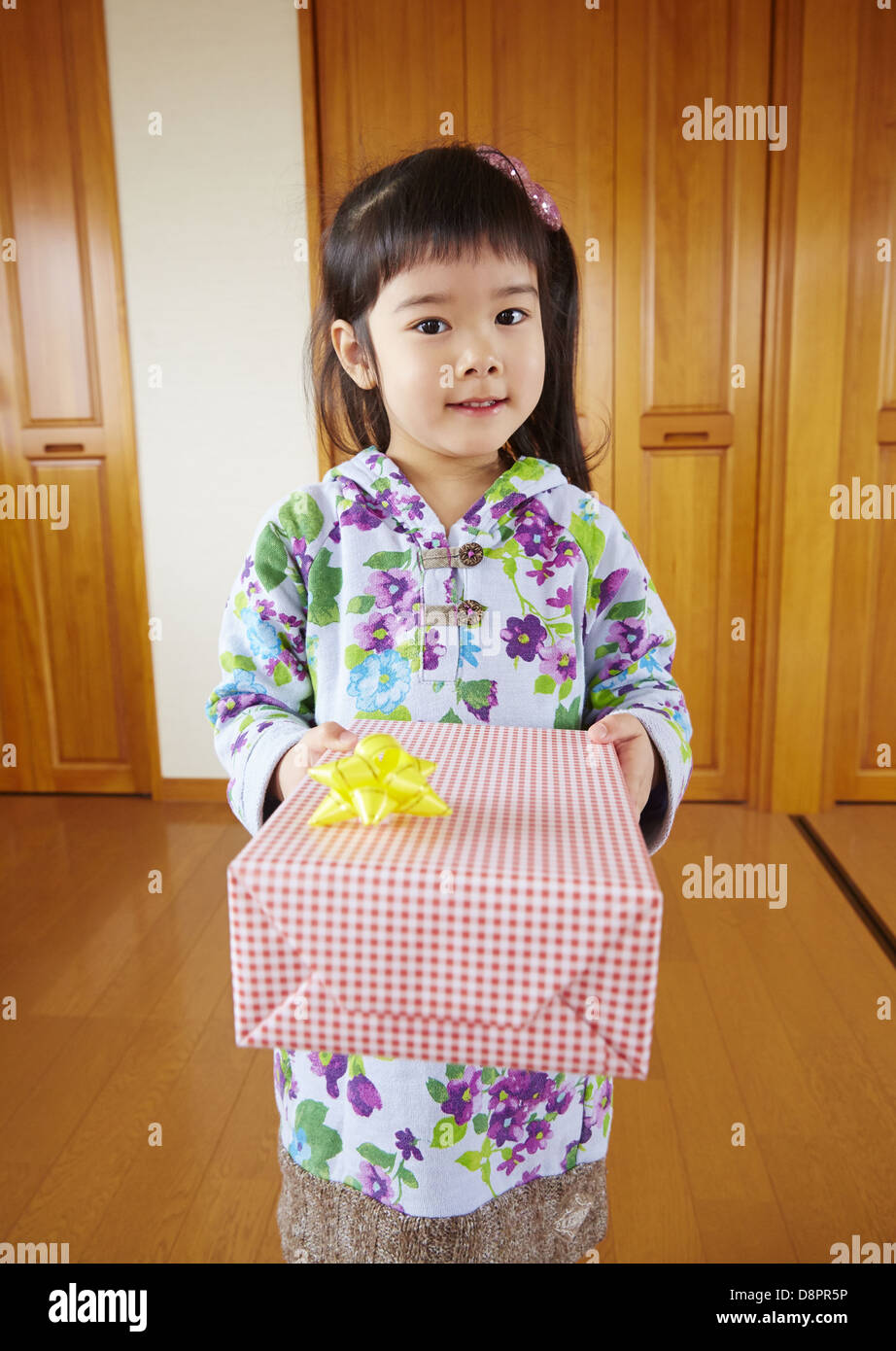 Girl getting a gift Stock Photo - Alamy