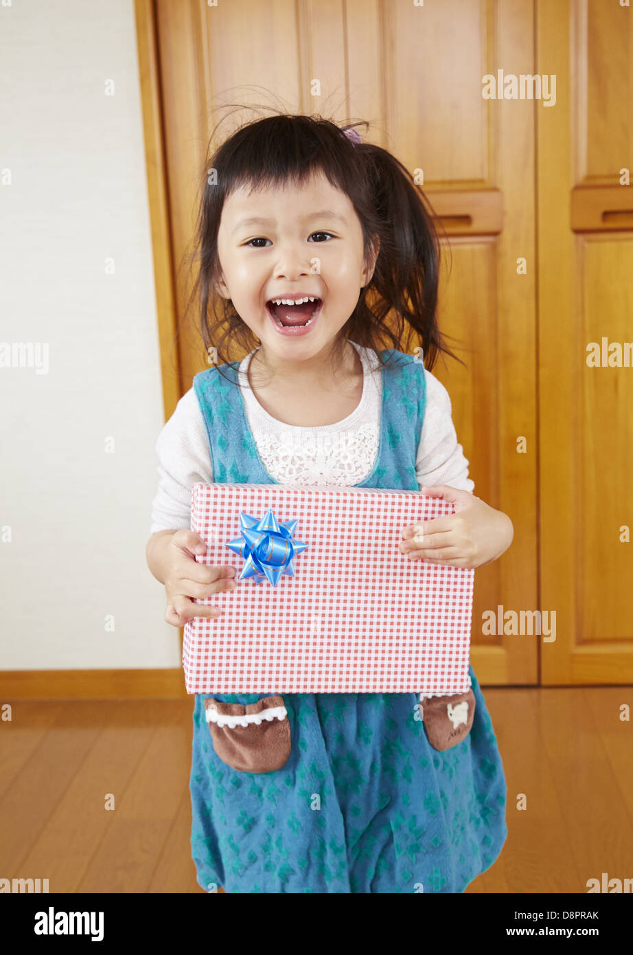 Girl getting a gift Stock Photo - Alamy