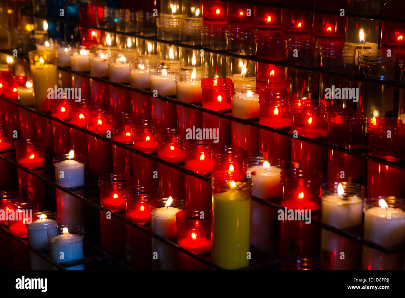 Burning candles in a church Stock Photo - Alamy