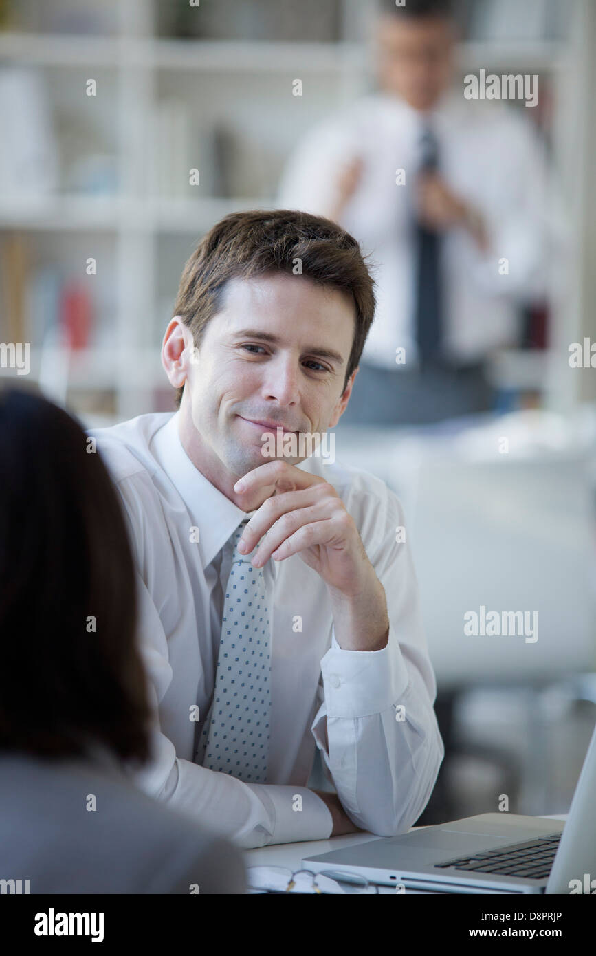 Business man hold chin businessman hi-res stock photography and images ...