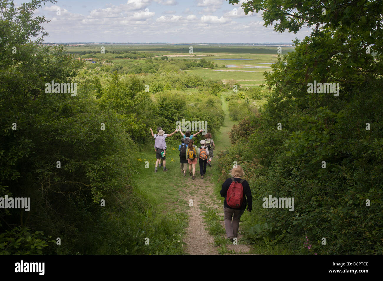 A group of country ramblers look across Northwood Hill's landscape ...
