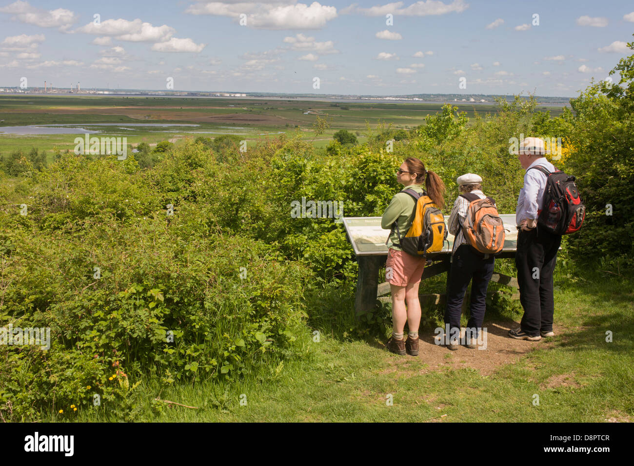 A group of country ramblers look across Northwood Hill's landscape ...