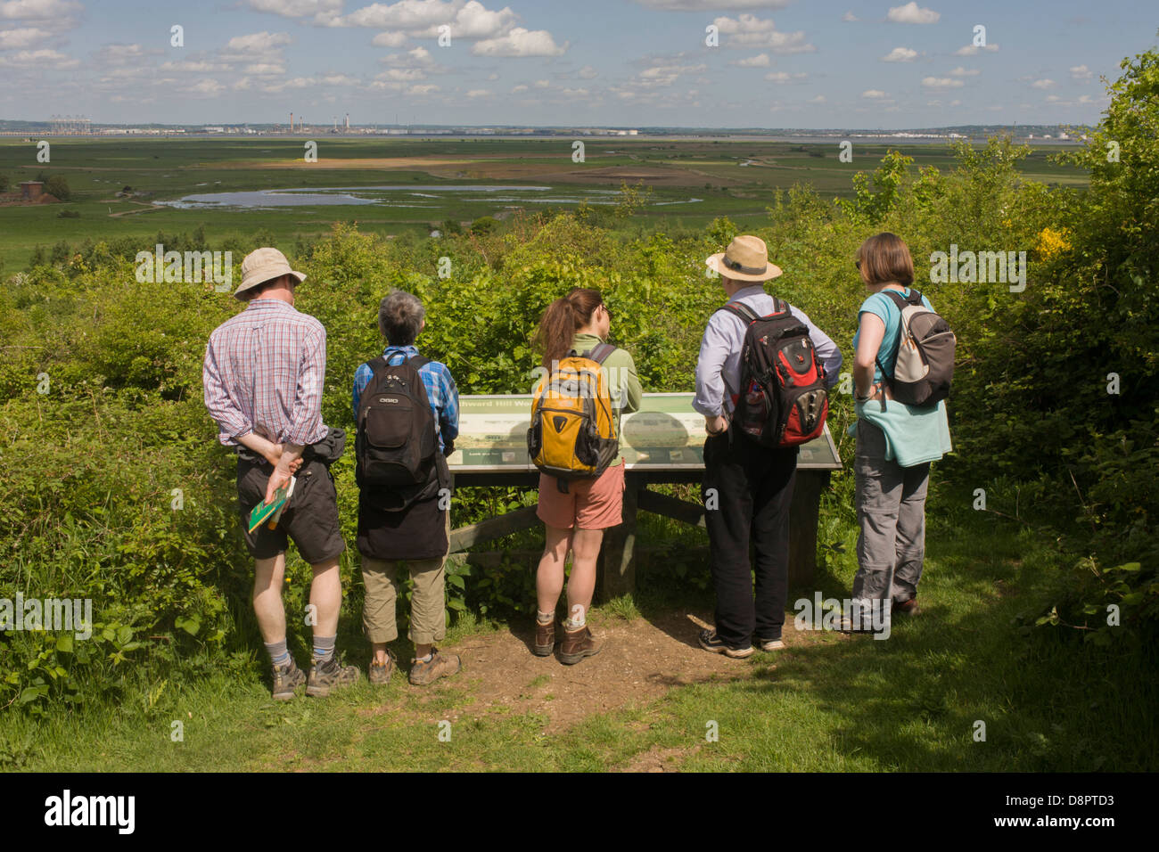 A group of country ramblers look across Northwood Hill's landscape ...
