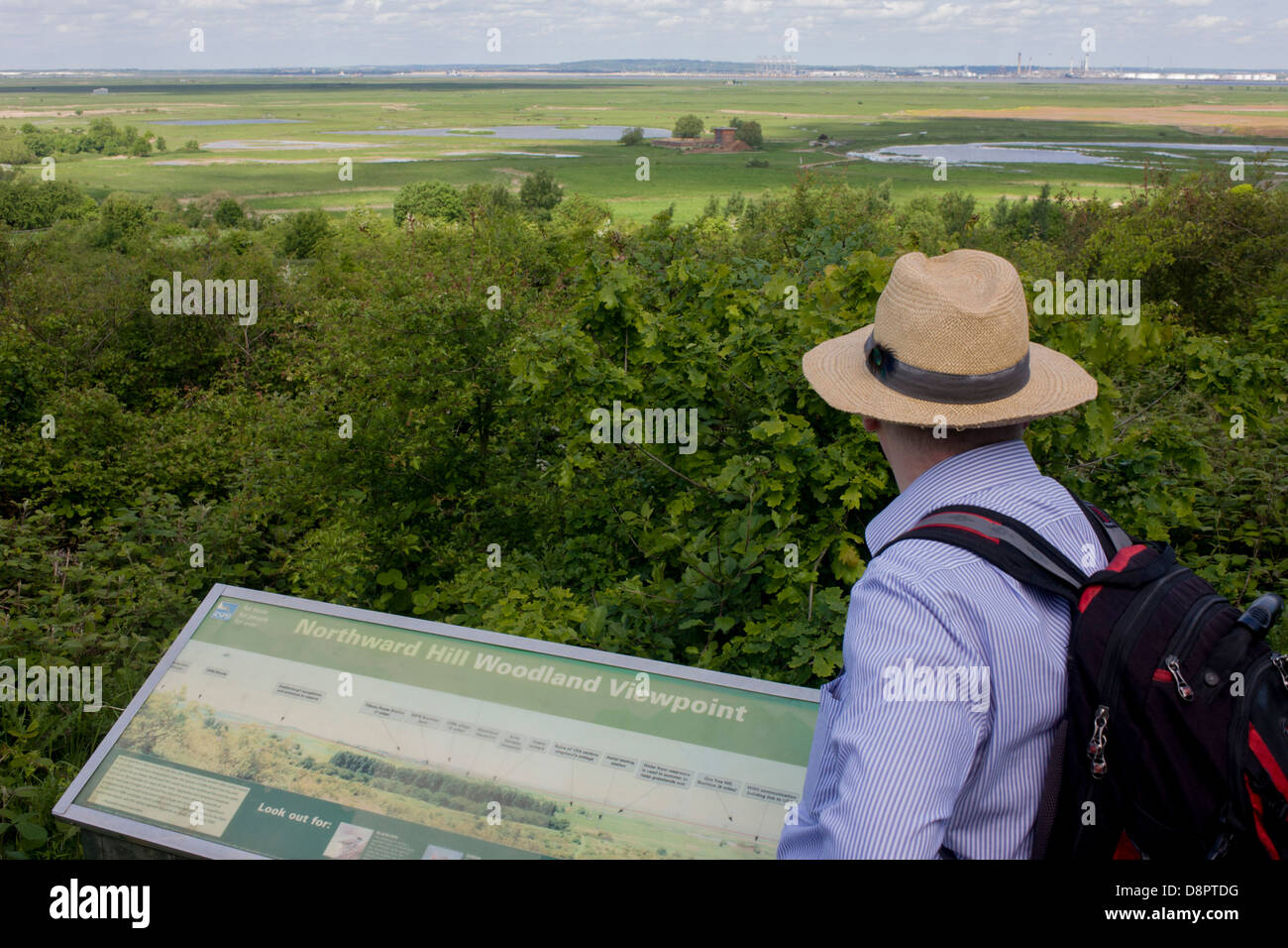 A country rambler looks out across Northwood Hill's landscape below, an ...