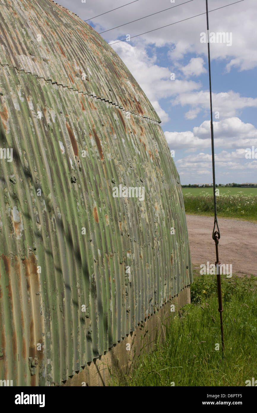 An old arched corrugated Nissen/Quonset hut shelter in a rural place ...