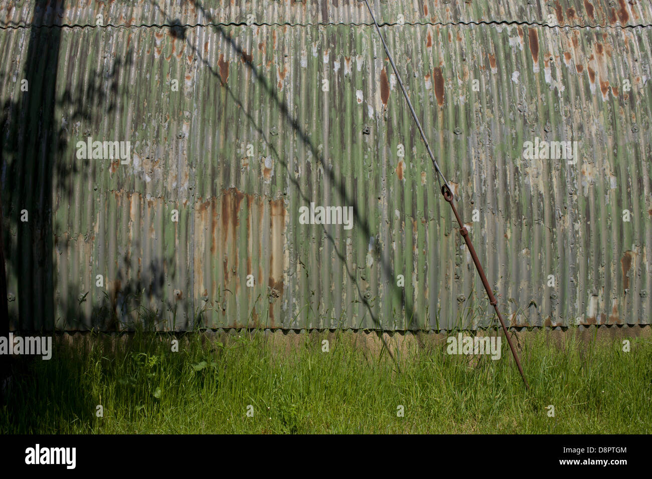 An old arched corrugated Nissen/Quonset hut shelter in a rural place ...