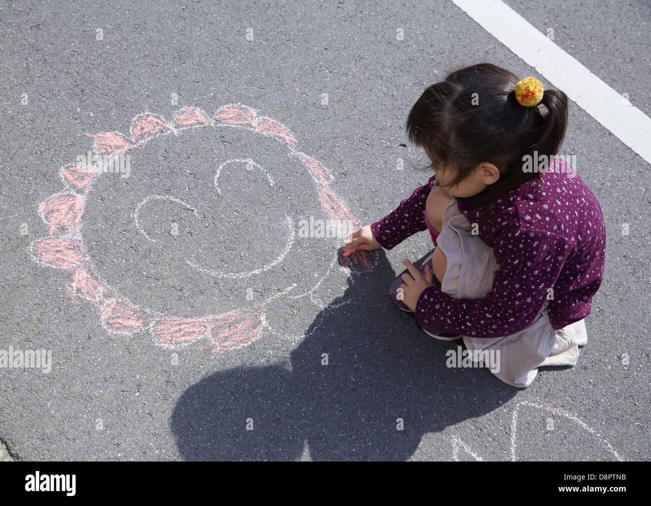 Girl drawing a picture with chalk Stock Photo - Alamy