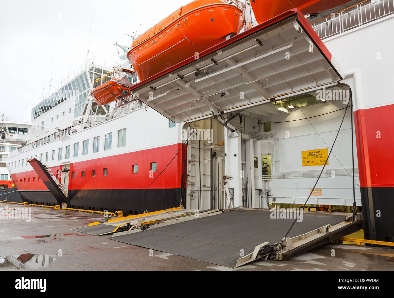 Opened side ramp gate on big passenger ferry in port Stock Photo - Alamy