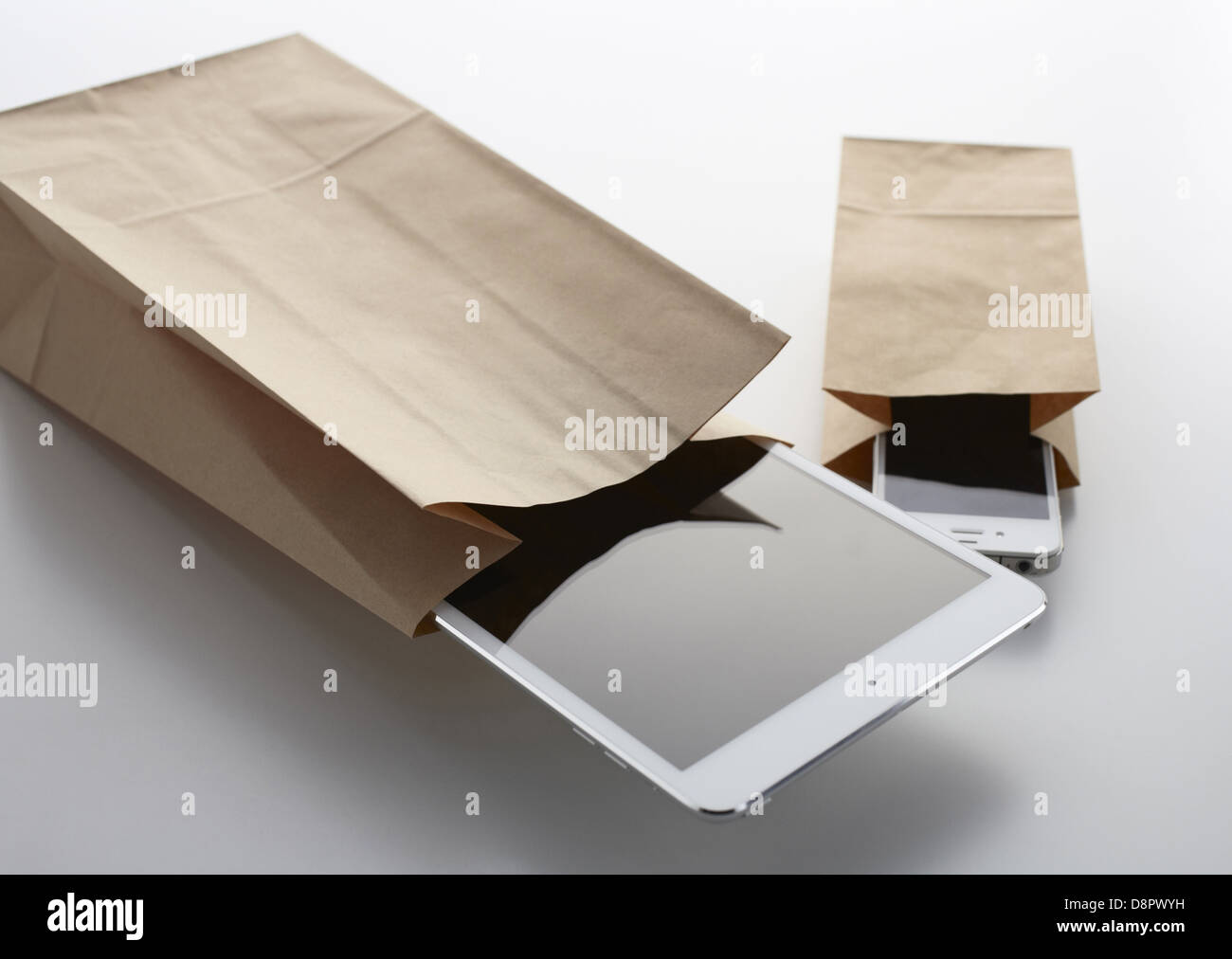 Smart devices in paper bags Stock Photo - Alamy