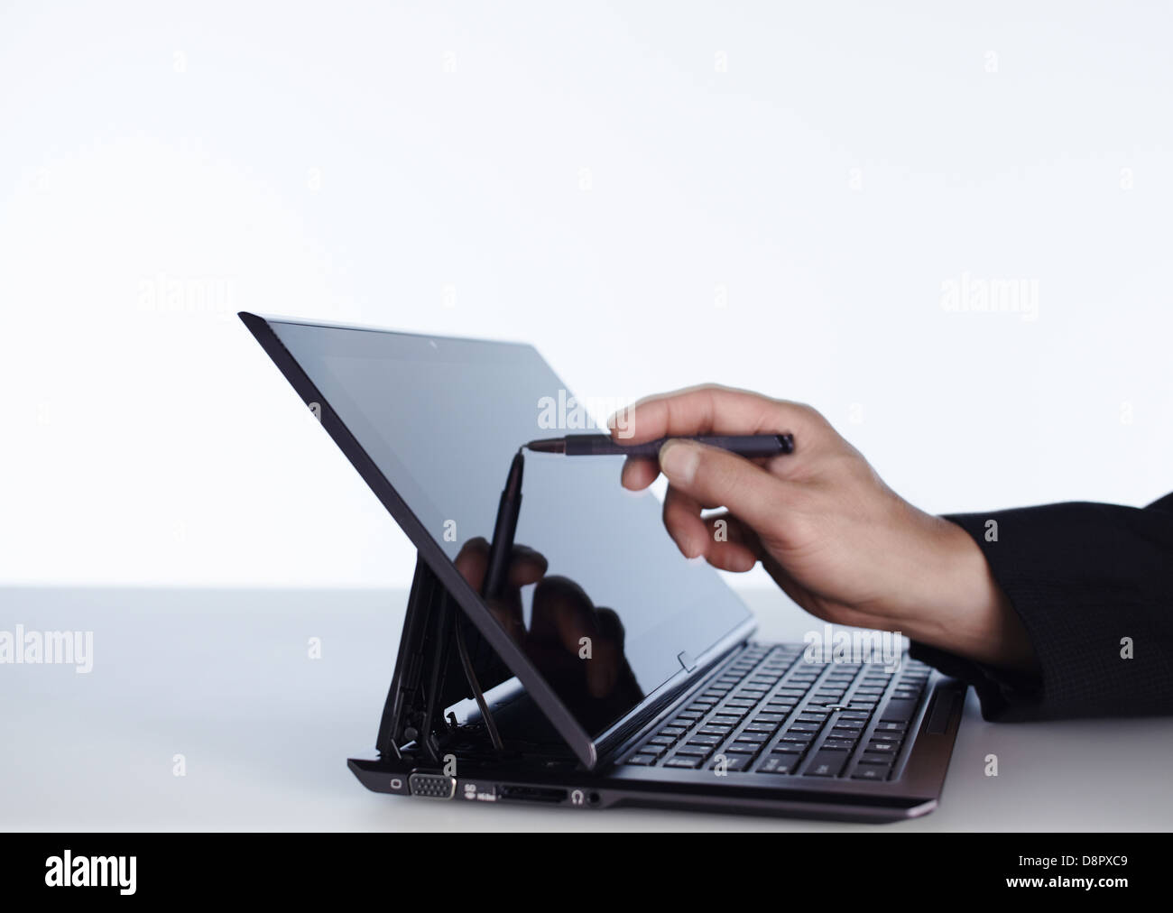 Hand using a tablet PC with a stylus Stock Photo - Alamy