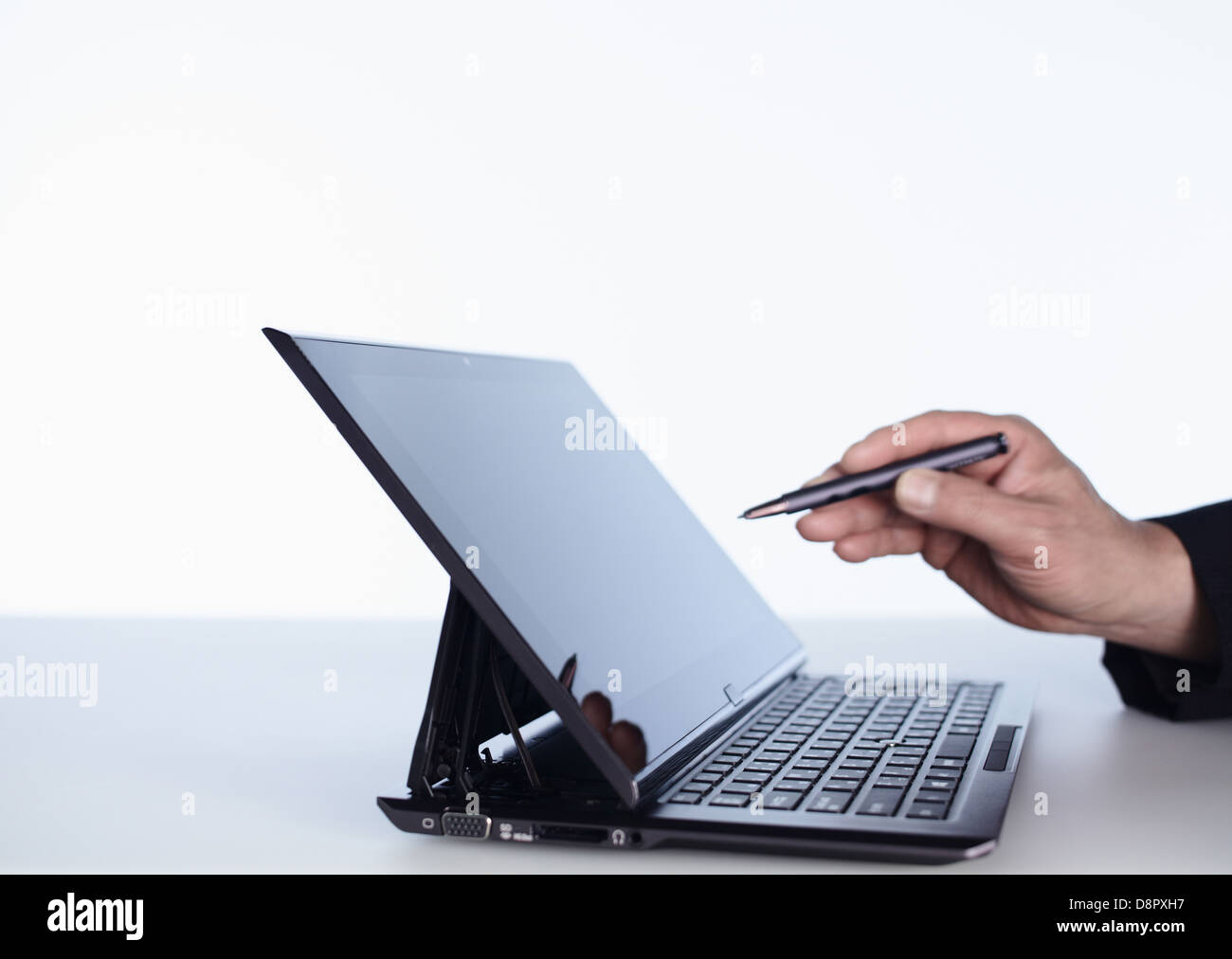 Hand using a tablet PC with a stylus Stock Photo - Alamy