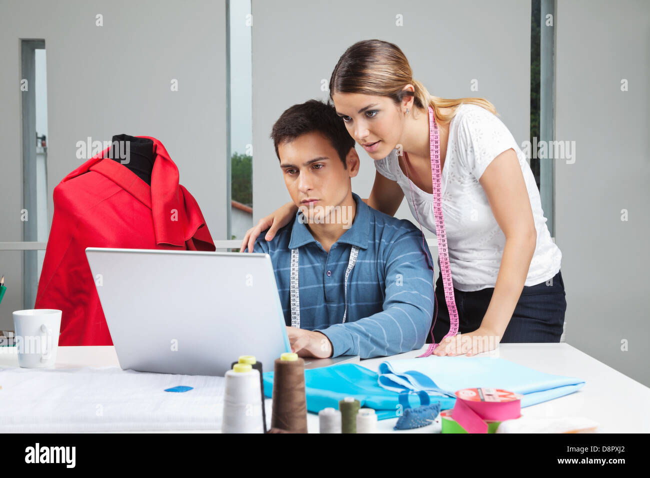 Clothing Designers Working On Laptop Stock Photo - Alamy