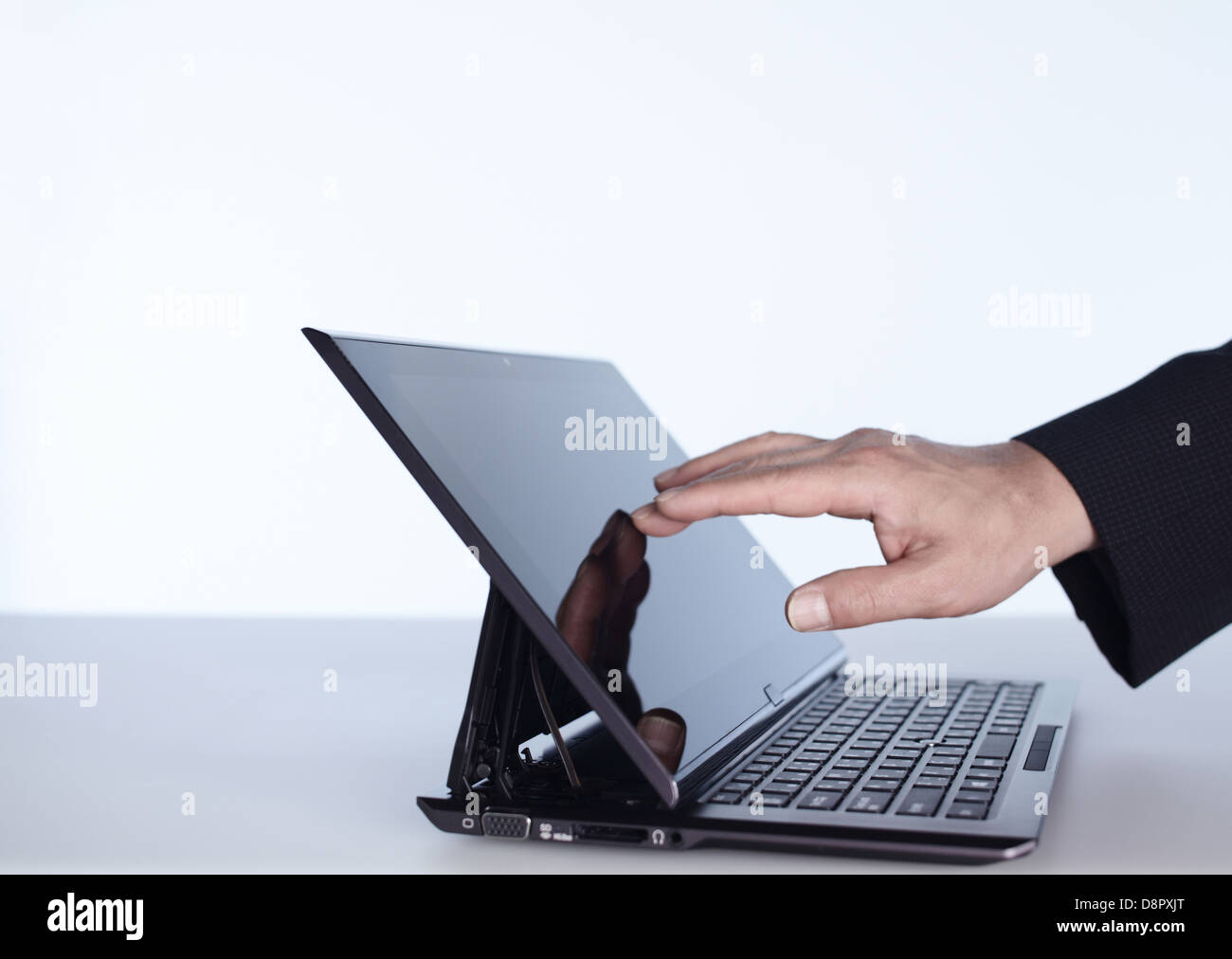 Hand touching a tablet PC Stock Photo - Alamy