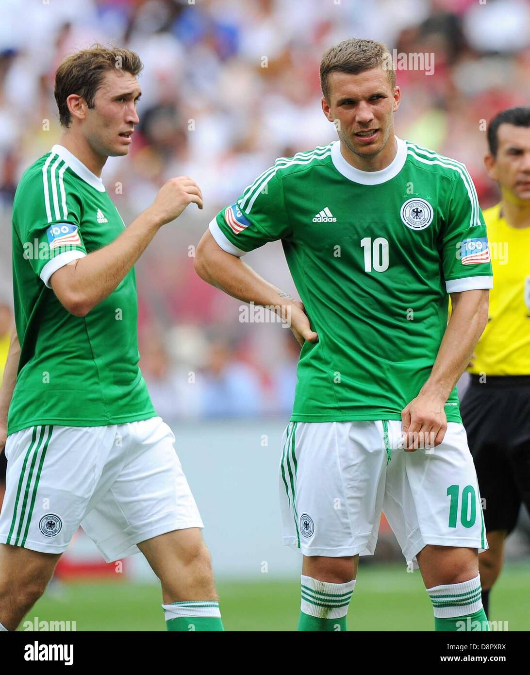 Stefan Reinartz (l) and Lukas Podolski of Germany react during the ...